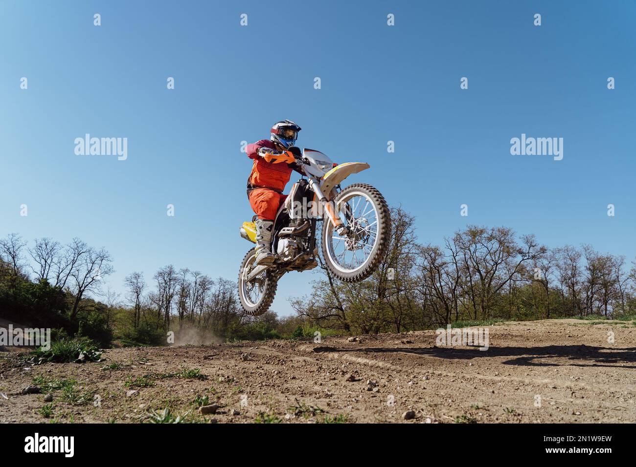 Man riding motorbike on motocross track Stock Photo - Alamy
