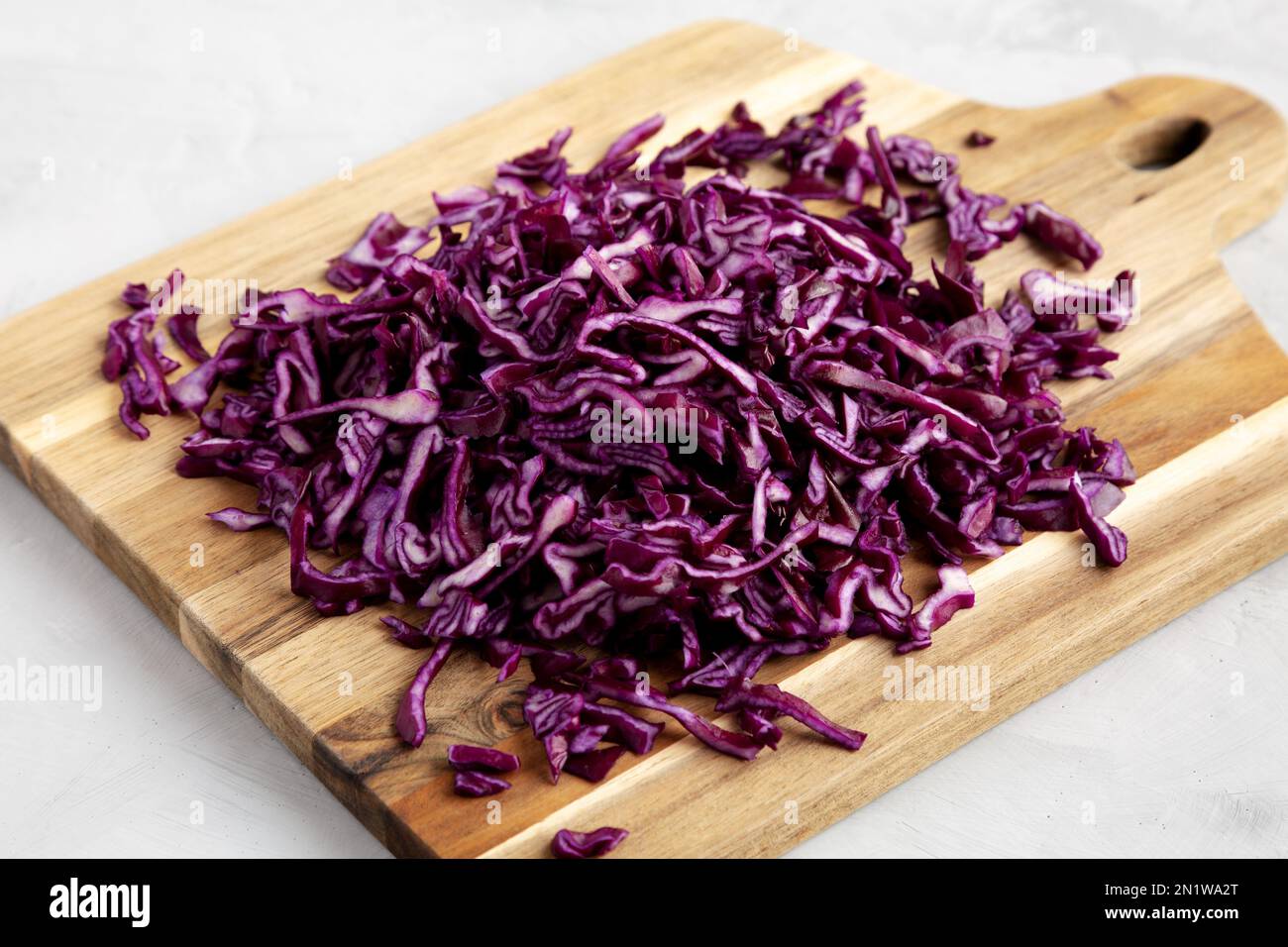 Shredded Purple Cabbage on a Board, side view Stock Photo - Alamy