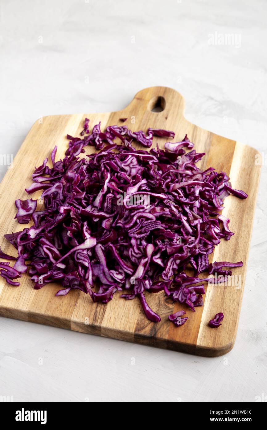 Shredded Purple Cabbage on a Board, side view Stock Photo - Alamy