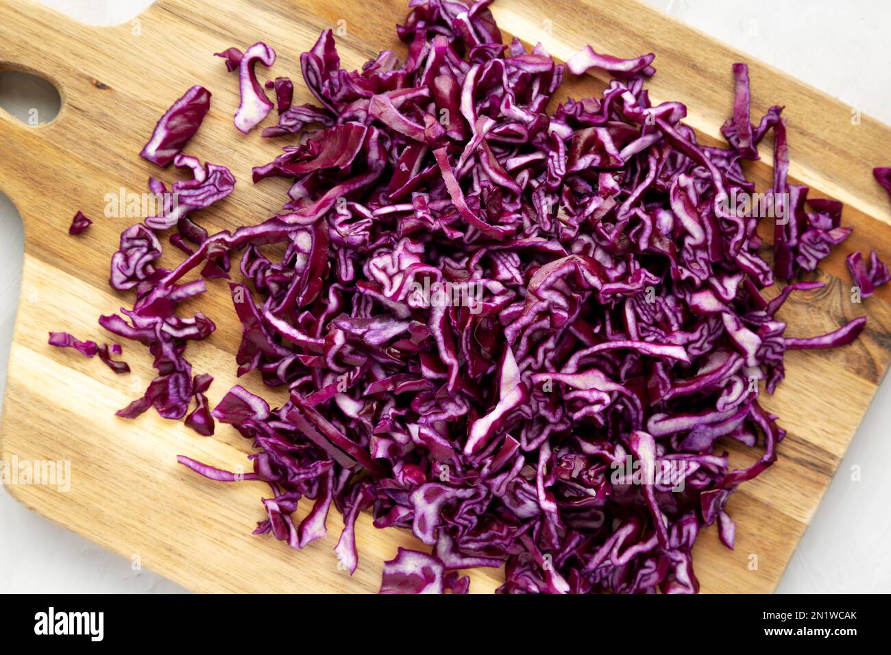 Shredded Purple Cabbage on a Board, top view. Flat lay, overhead, from ...