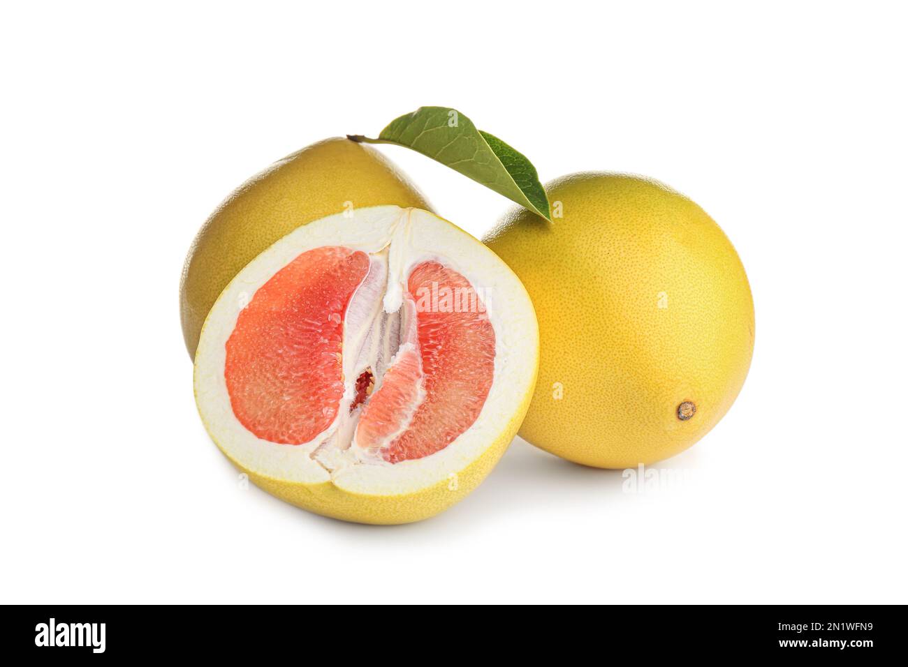 Fresh cut and whole pomelo fruits isolated on white Stock Photo - Alamy