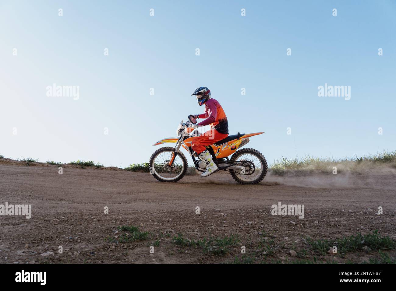 Man riding motorbike on motocross track Stock Photo - Alamy