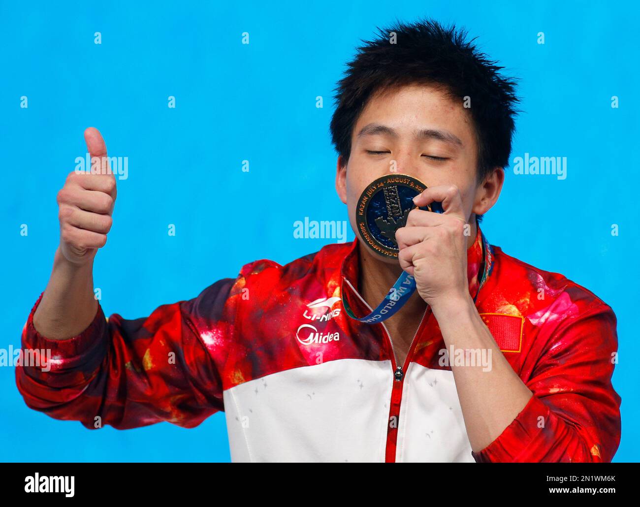 China’s gold medalist Chao He poses following the medal ceremony for ...