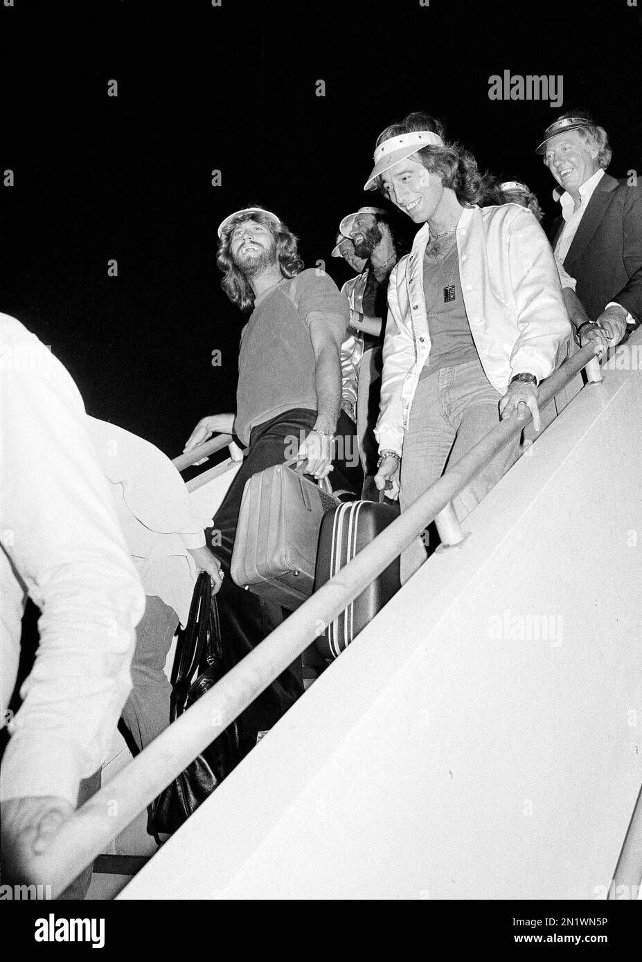 The Bee Gees, from left, Barry Gibb, Maurice Gibb, in background, and ...
