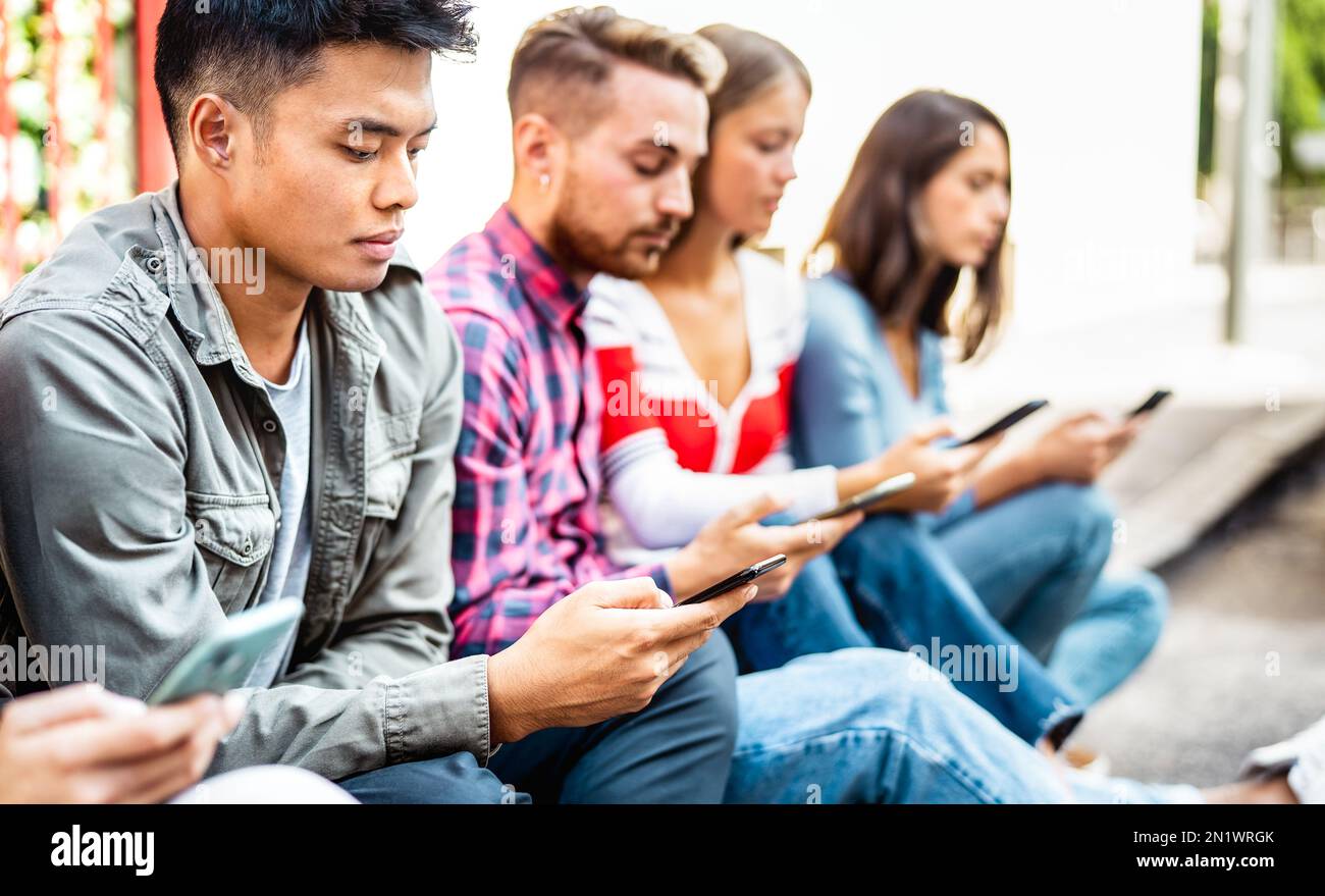 Bored people using smartphone sitting at university college campus ...