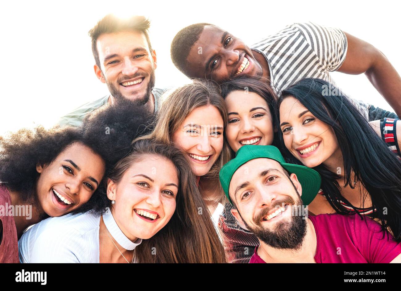 Multicultural guys and girls taking funny selfie - Happy millenial ...