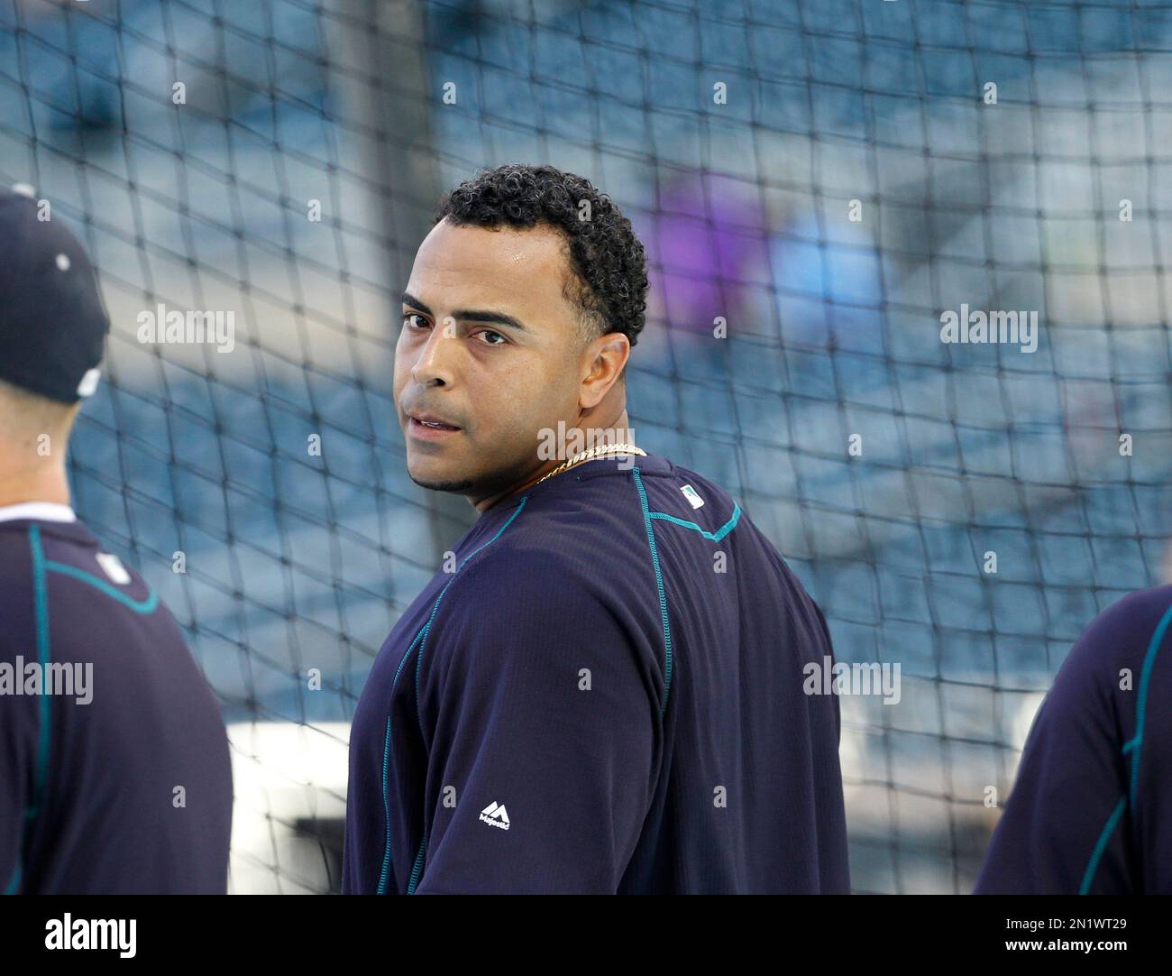 Seattle Mariners right fielder Nelson Cruz talks with a teammate before ...