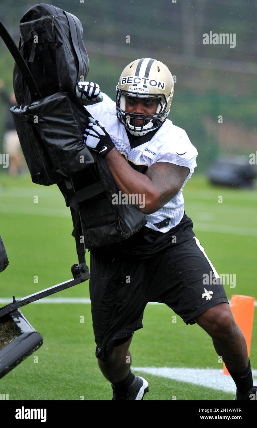 New Orleans Saints tackle Nick Becton (67) hits the pads during the ...