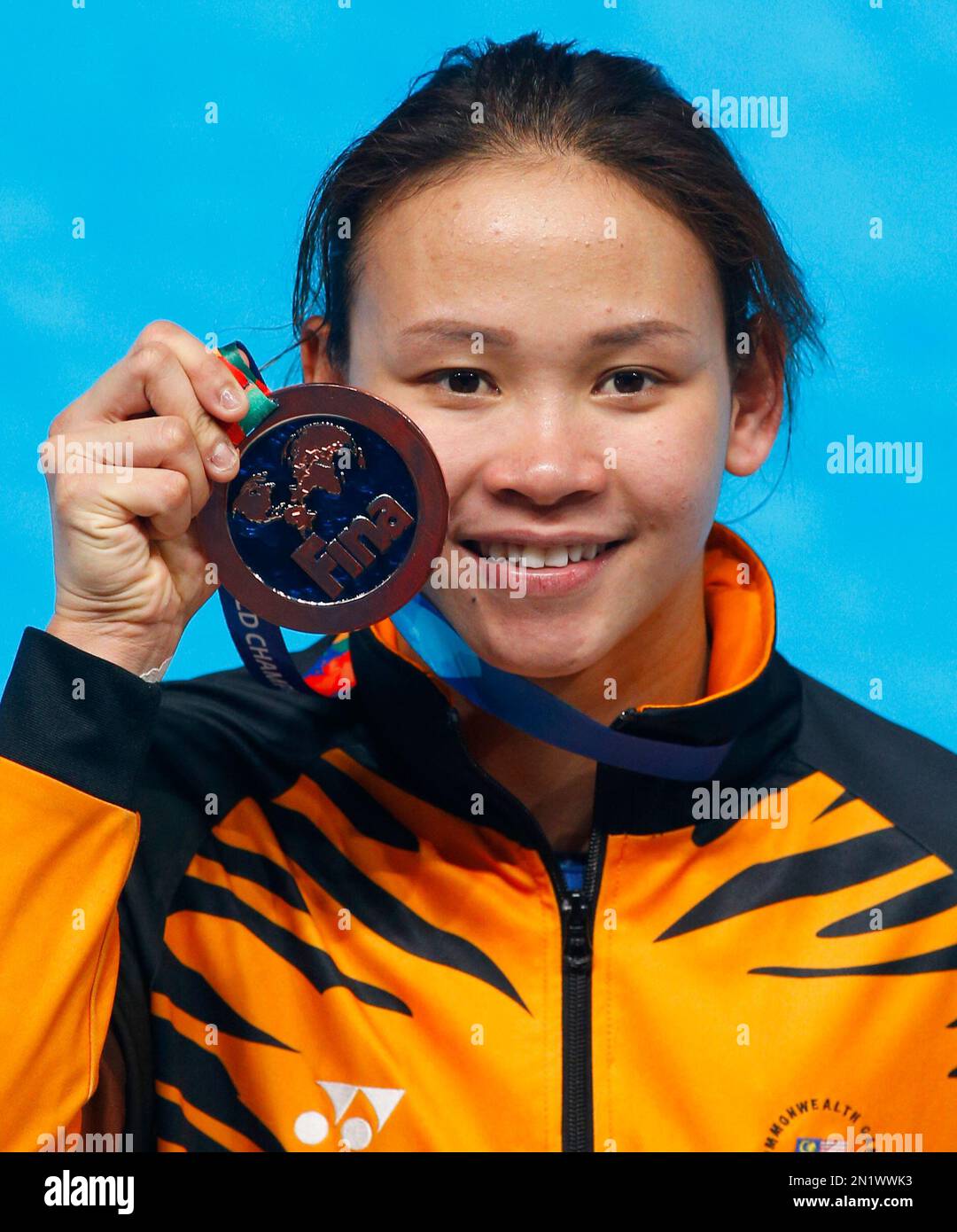 Malaysia’s bronze medalist Pandelela Pamg poses following the medal ...