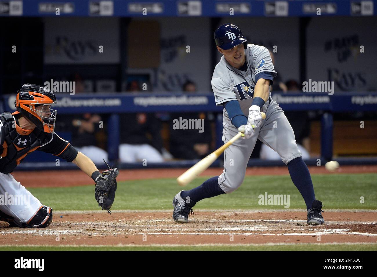 Tampa Bay Rays' Brandon Guyer, right, hits a single in front of ...