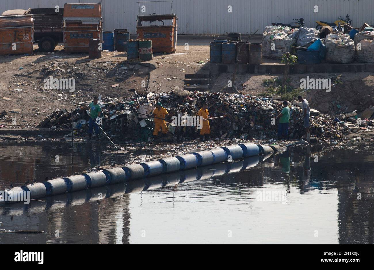 In this July 28, 2015 photo, workers remove garbage collected by ...