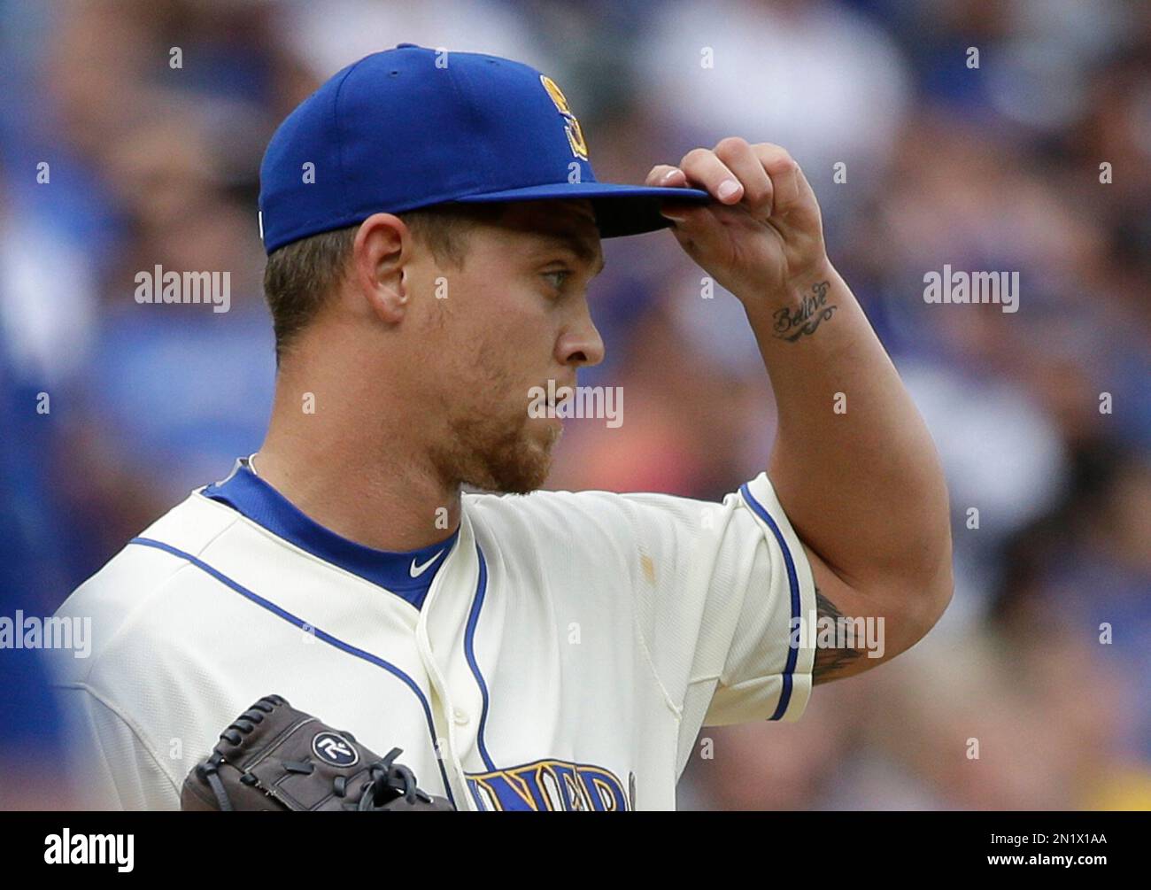 Seattle Mariners relief pitcher David Rollins walks back to the mound ...