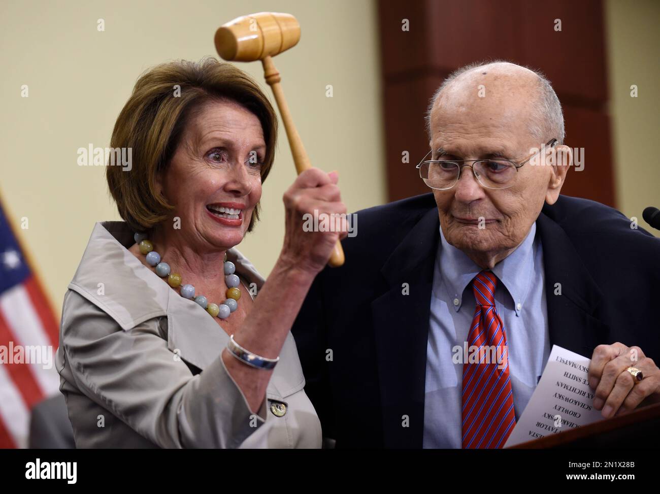 House Minority Leader Nancy Pelosi of Calif., standing with former Rep ...