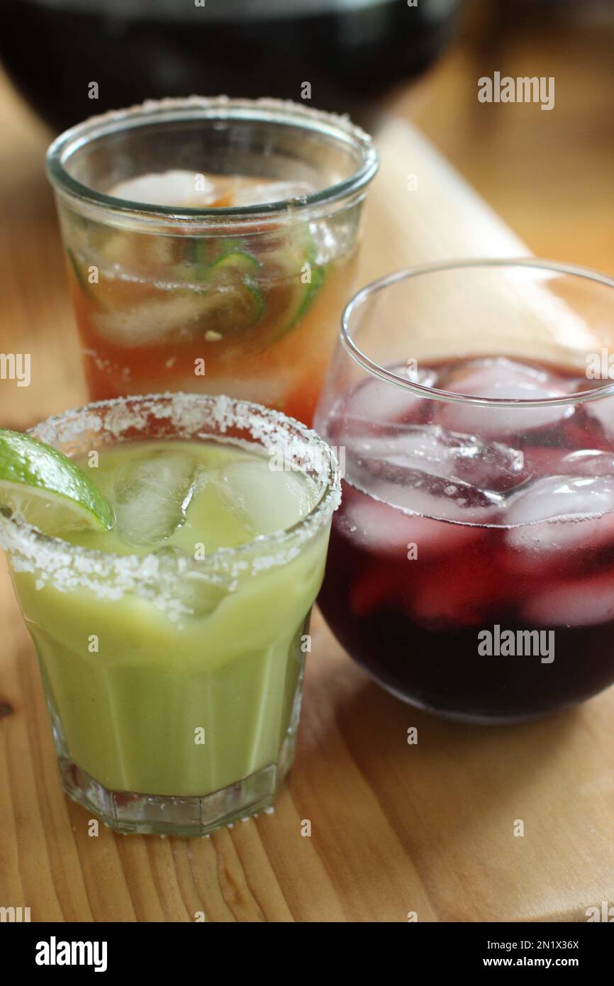 This July 13, 2015 photo shows, from right clockwise, a hibiscus cooler ...