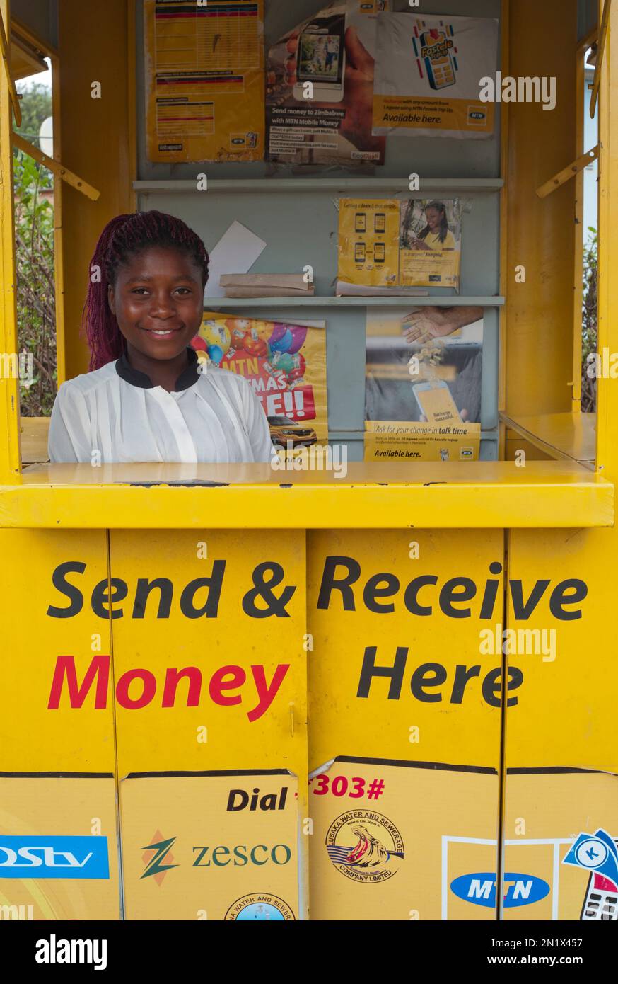 Portrait of a young lady in a mobile money transfer kiosk Stock Photo ...