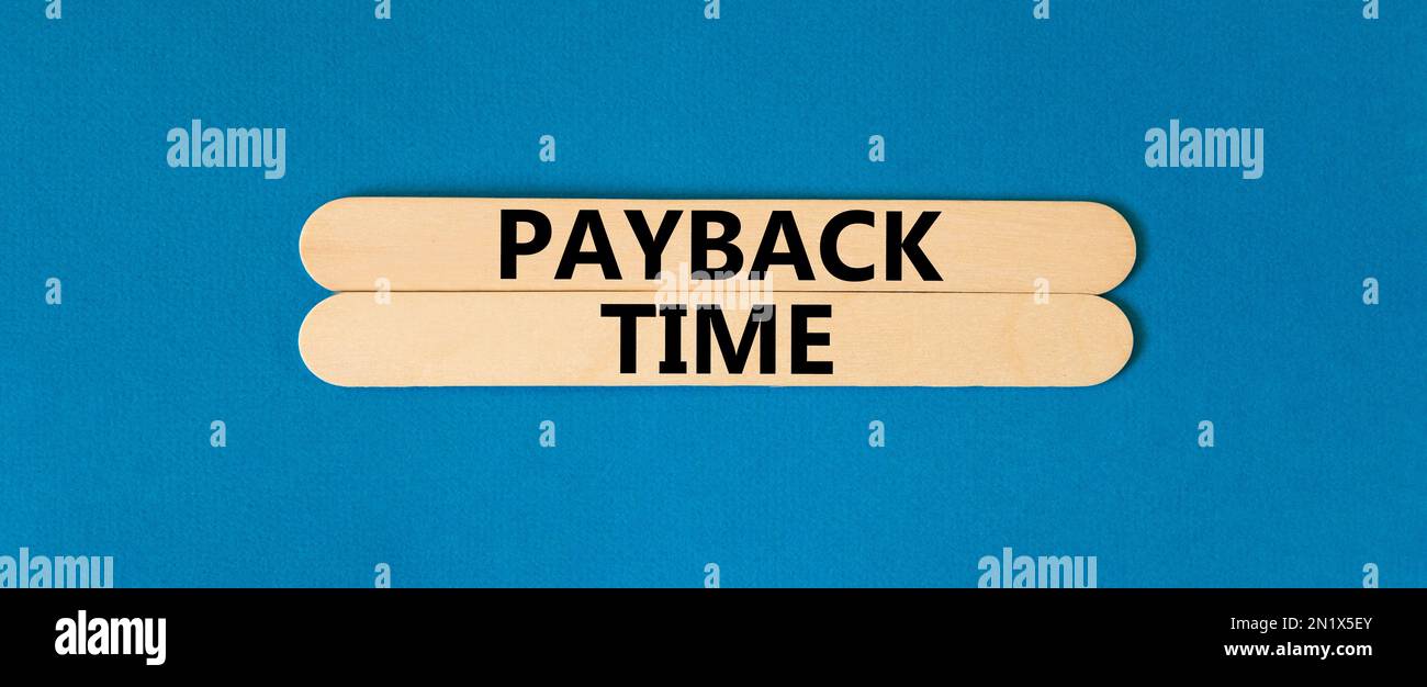 Payback time symbol. Concept words Payback time on wooden stick ...