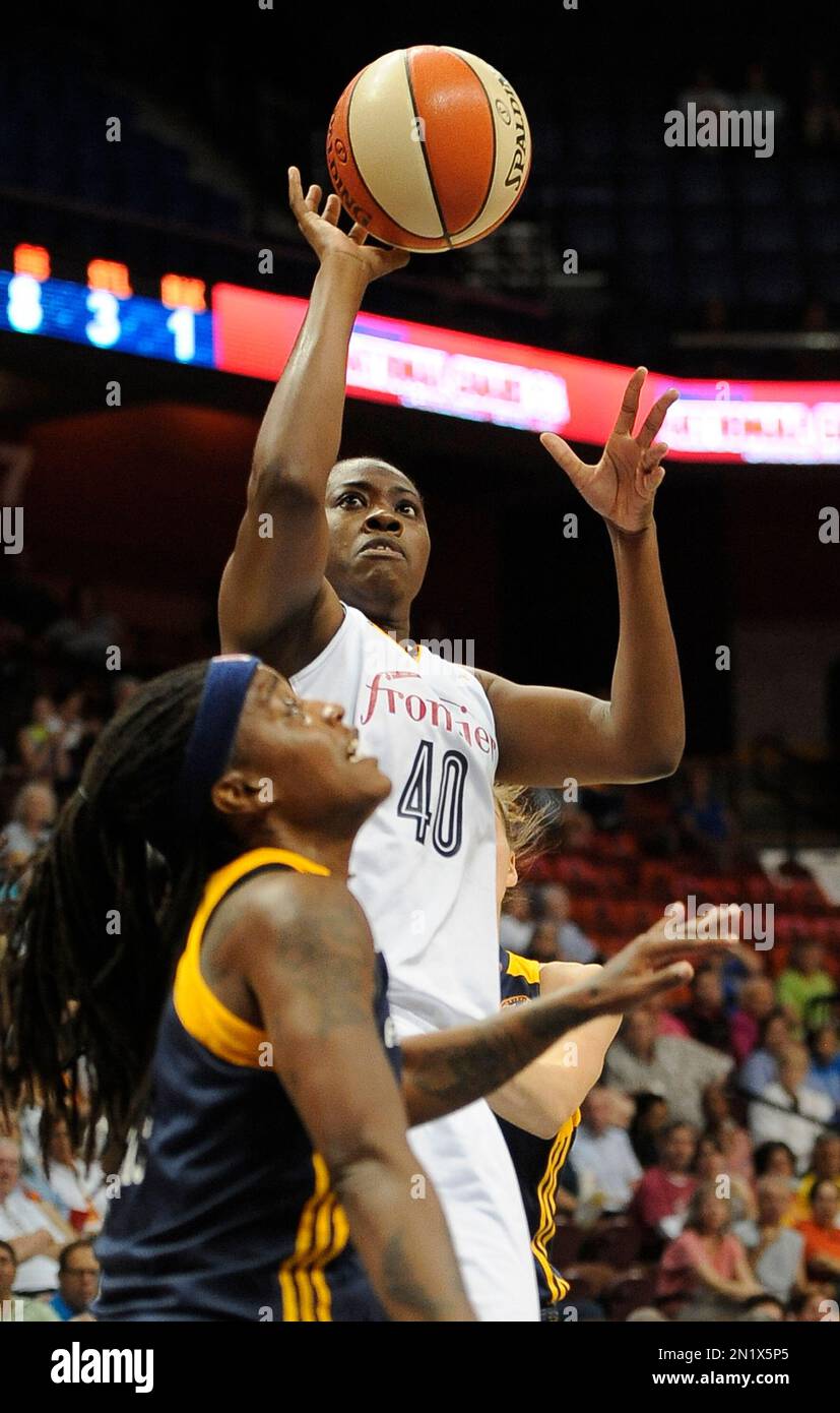 Connecticut Sun’s Shekinna Stricklen, right, shoots over Indiana Fever ...