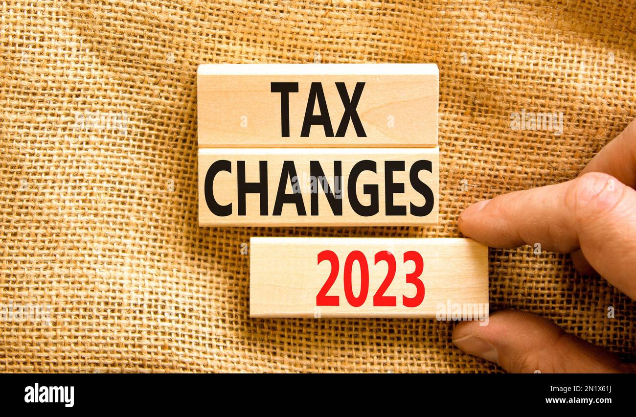 Tax changes 2023 symbol. Concept words Tax changes 2023 on wooden ...