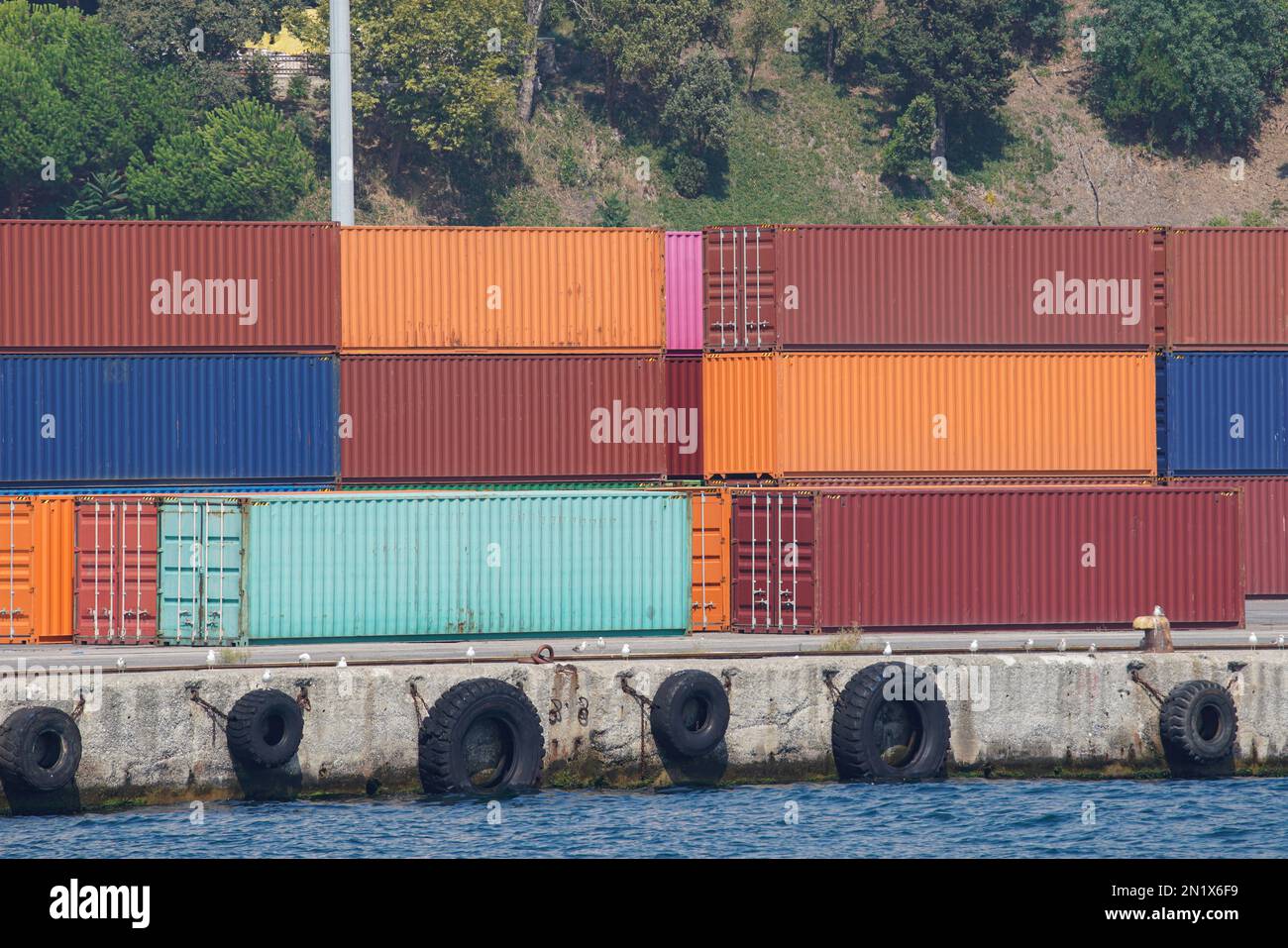 Containers waiting to transfer in a port Stock Photo - Alamy