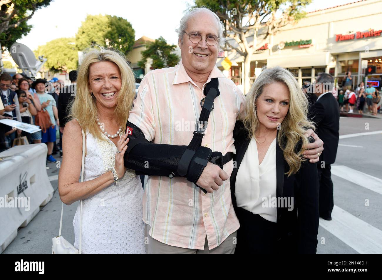 Chevy Chase, center, a cast member in "Vacation," poses with his wife ...