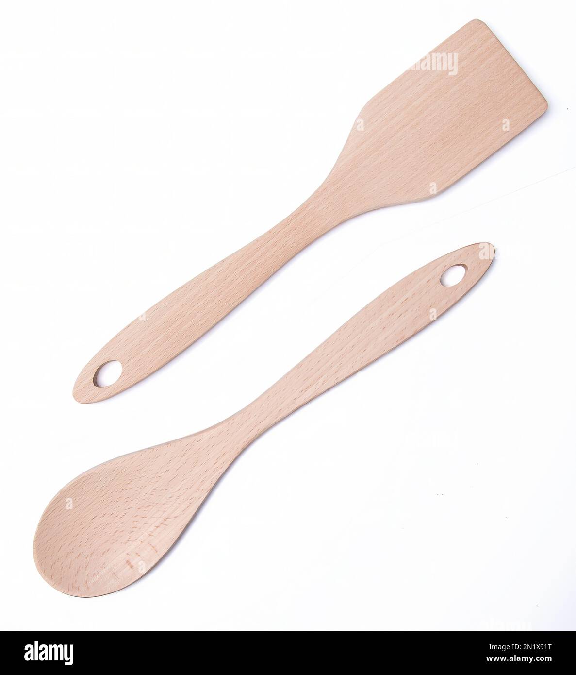 Wooden cookware in kitchen for mixing on stovetop on white Stock Photo ...