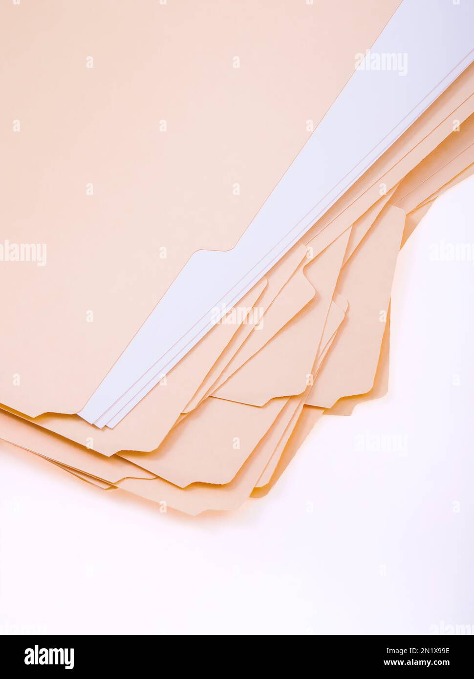 Overworked office worker with stacks of files to organize Stock Photo ...