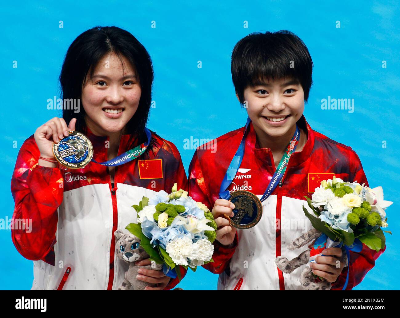 China’s gold medalists Chen Ruolin and Liu Huixia pose after the medal ...