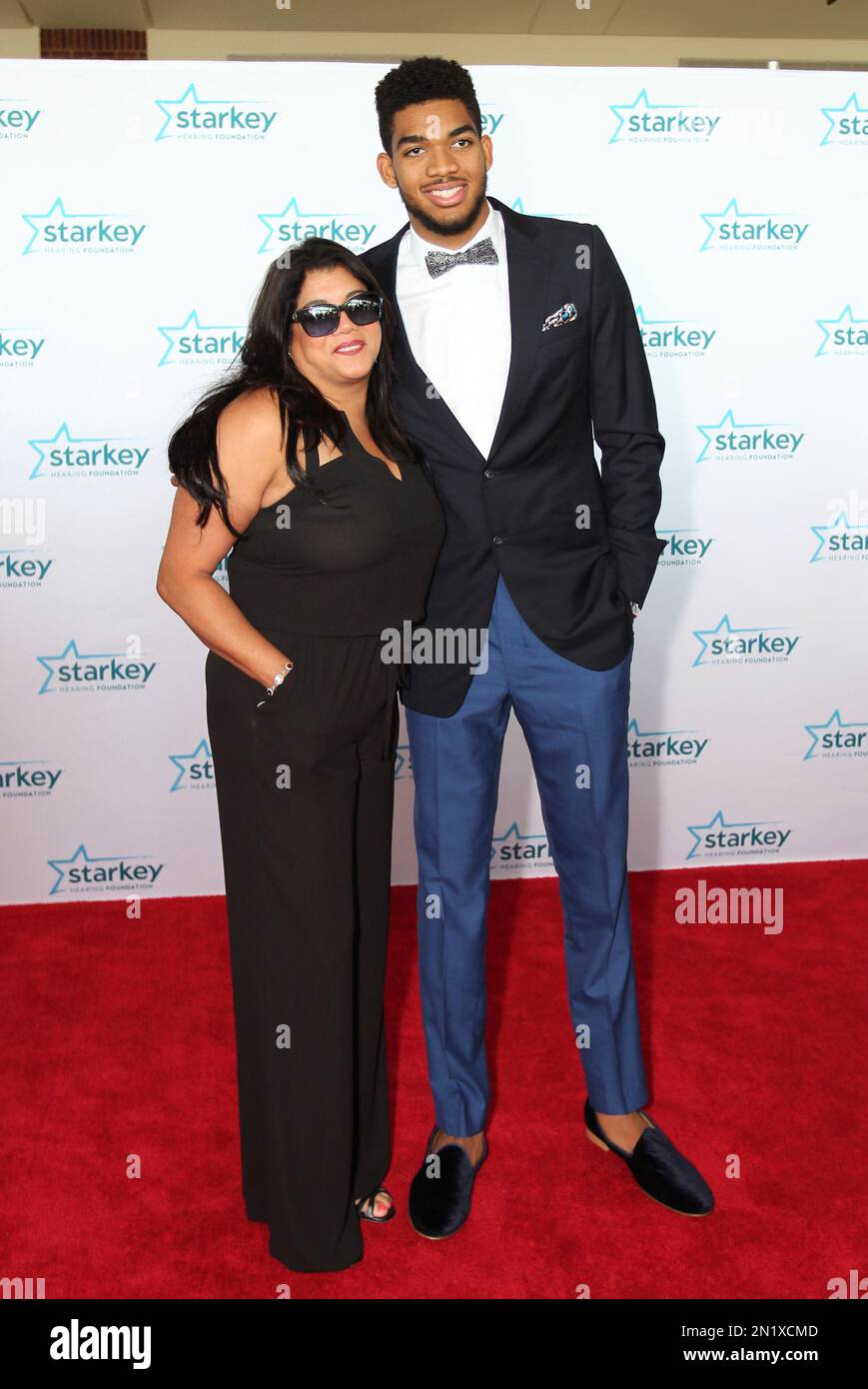 Karl Anthony-Towns with guest at the Starkey Hearing Foundation So The ...