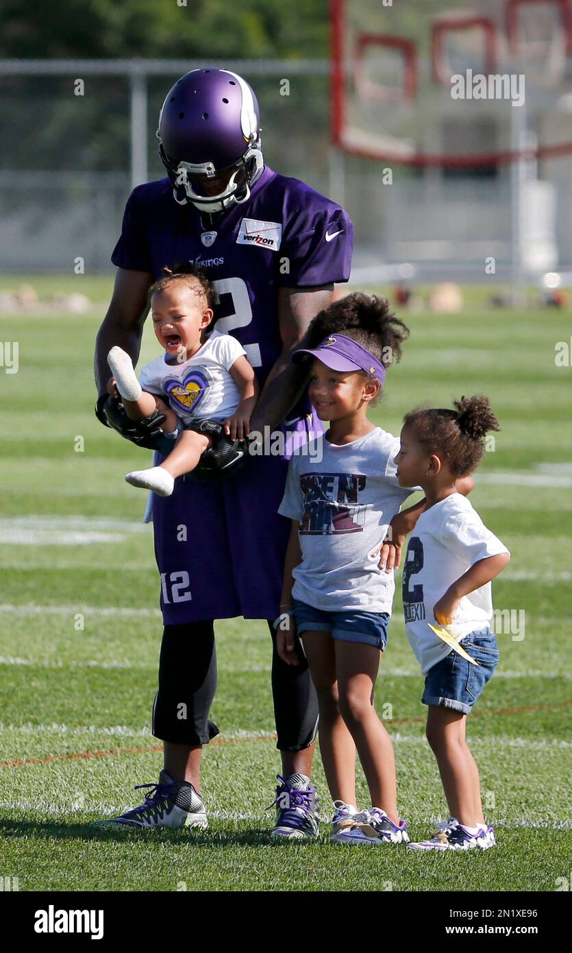 Minnesota Vikings wide receiver Charles Johnson holds his crying ...