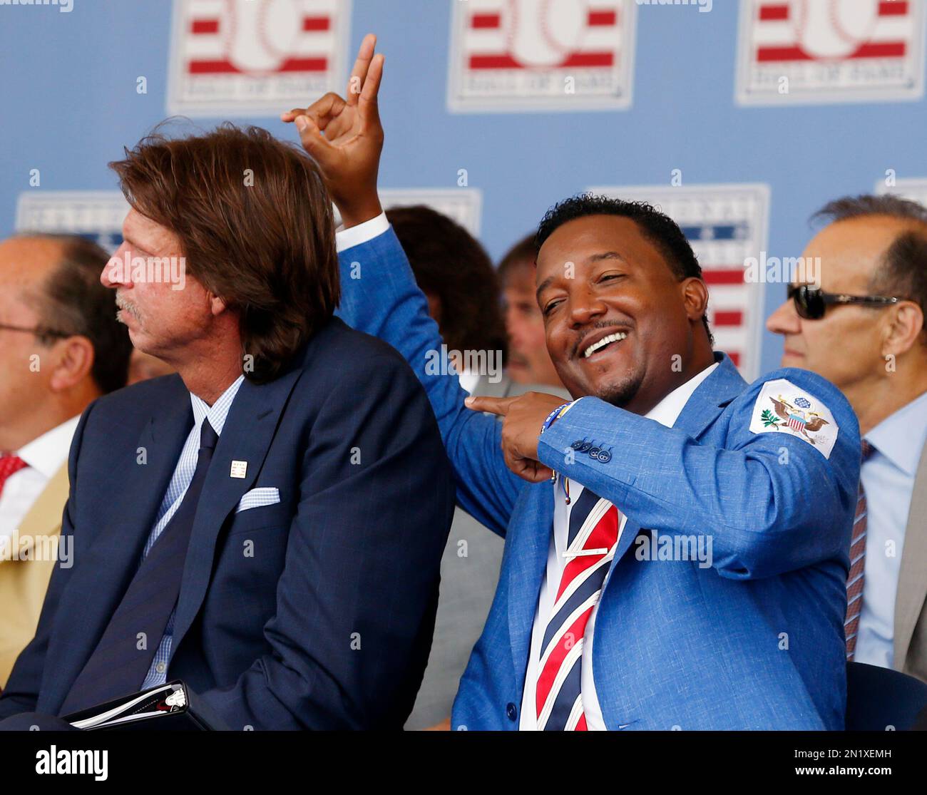 National Baseball Hall of Fame inductee Pedro Martinez, right, jokes ...