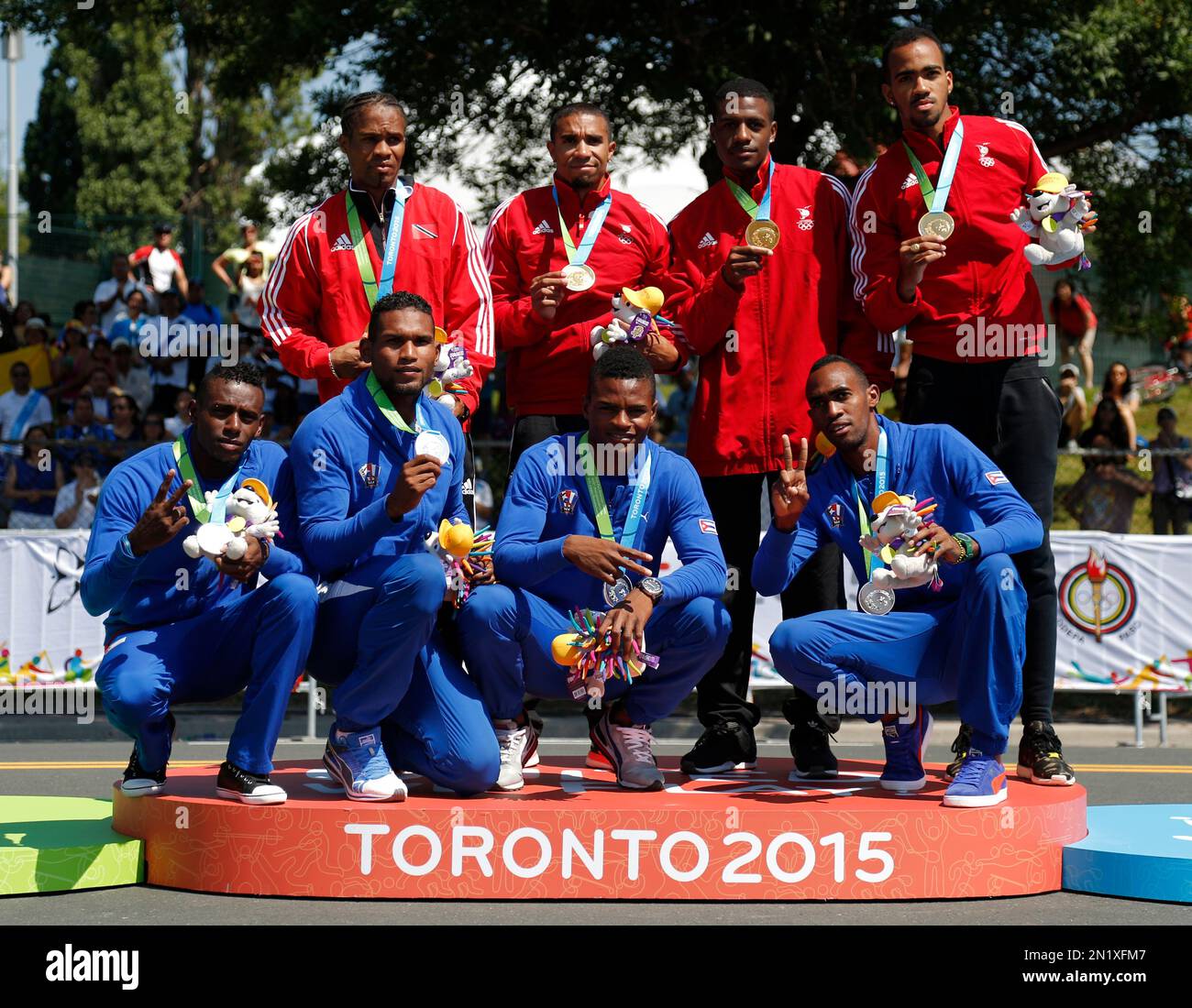 Members of the Cuba 4x400 meters, bottom, wear their silver medals ...