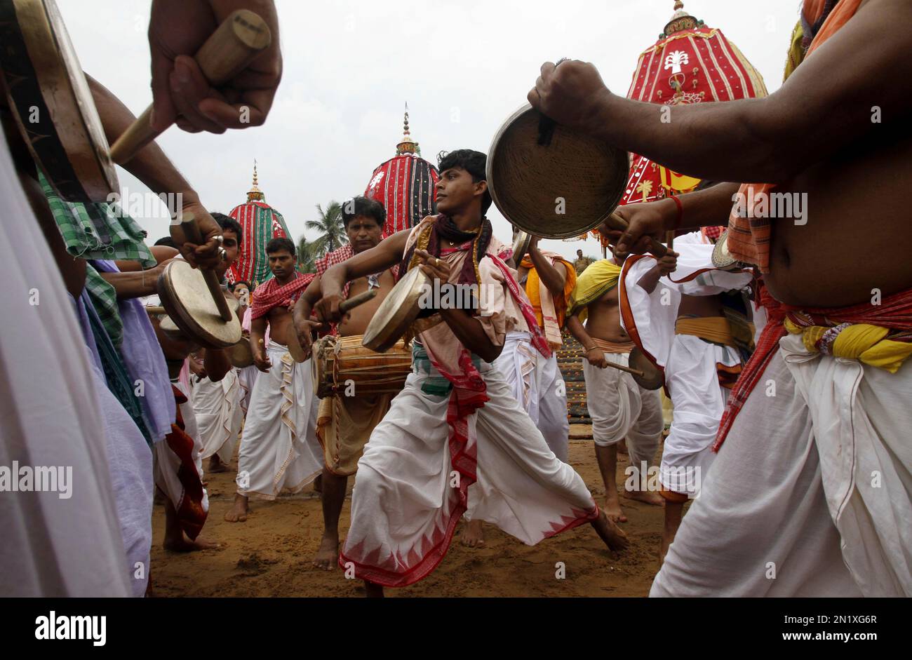 Priests of Lord Jagannath Hindu temple play traditional instruments ...