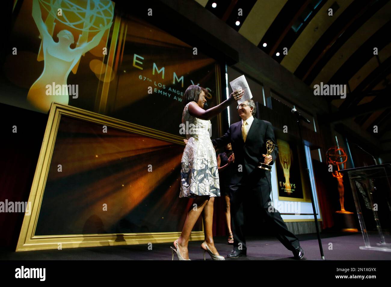 Paul Button, right, presents the Governors Award to Pat Harvey at the ...