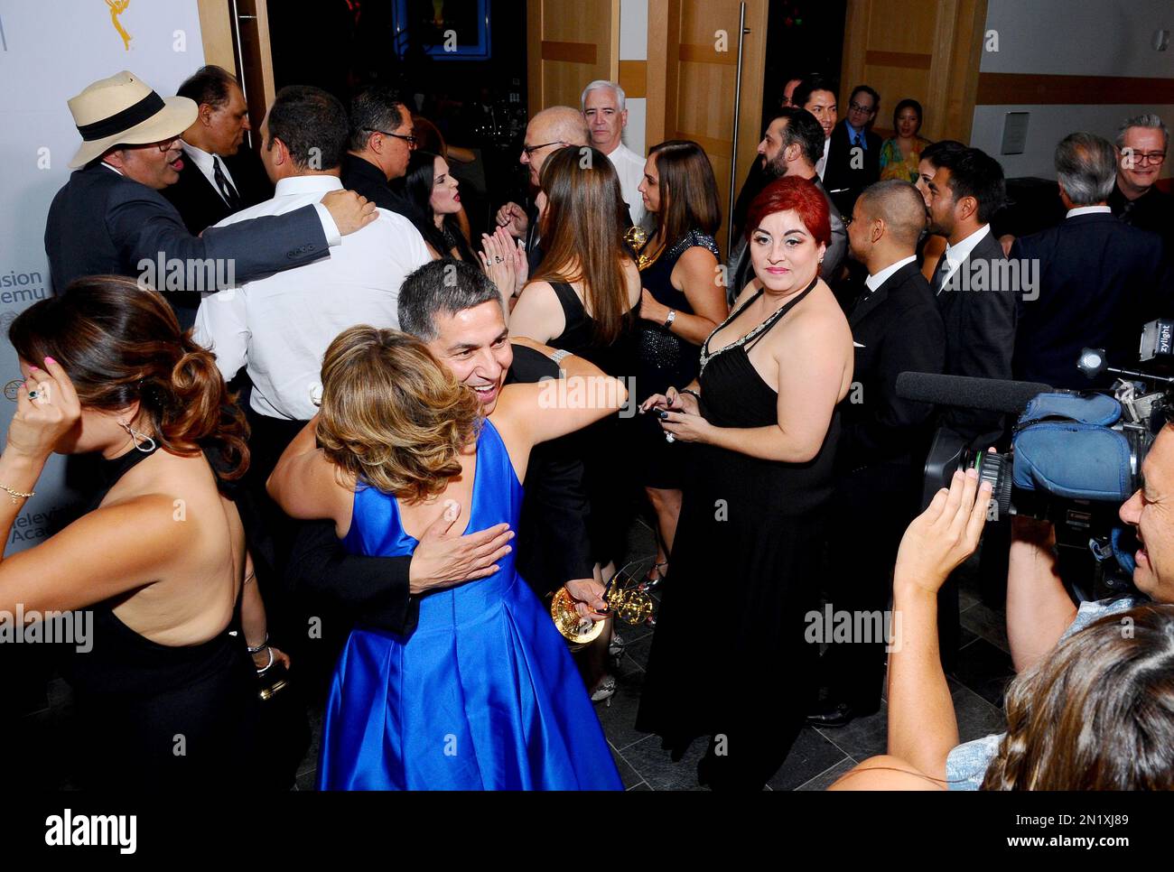 The KMEX team, winner of the award for regularly scheduled daily ...