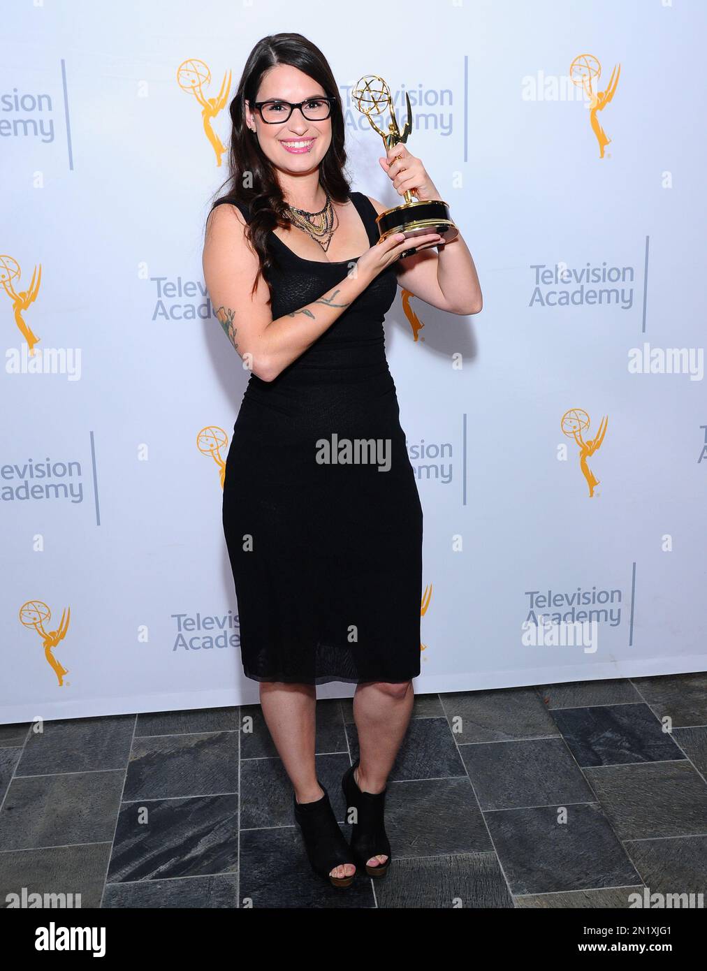 Cara Santa Maria, of KCET, poses for a portrait with the award for ...