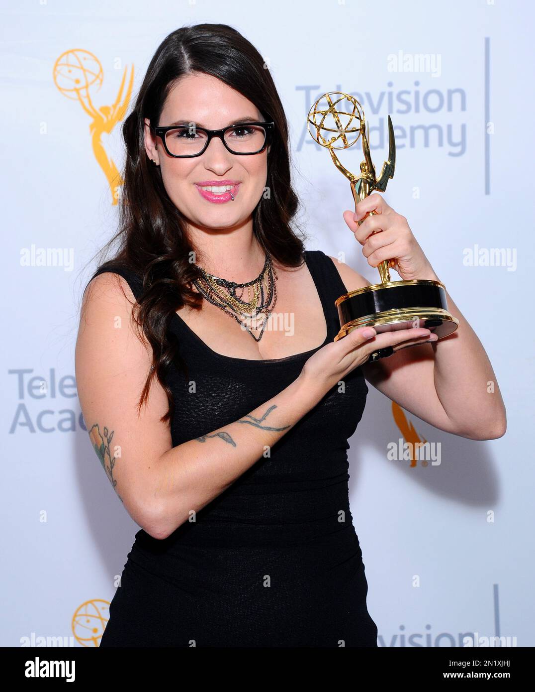Cara Santa Maria, of KCET, poses for a portrait with the award for ...