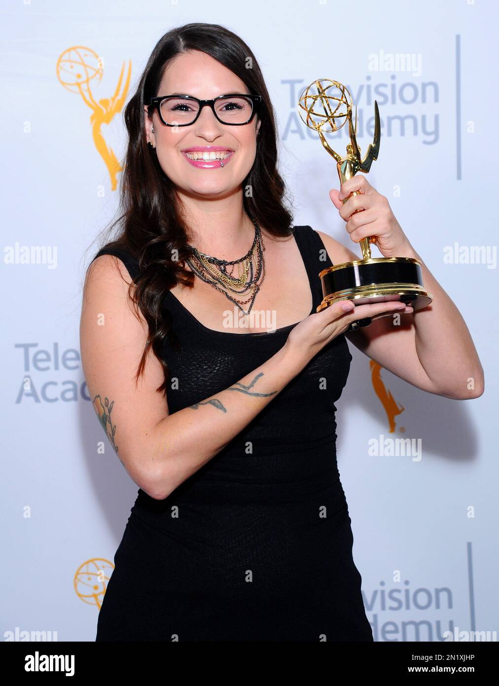 Cara Santa Maria, of KCET, poses for a portrait with the award for ...