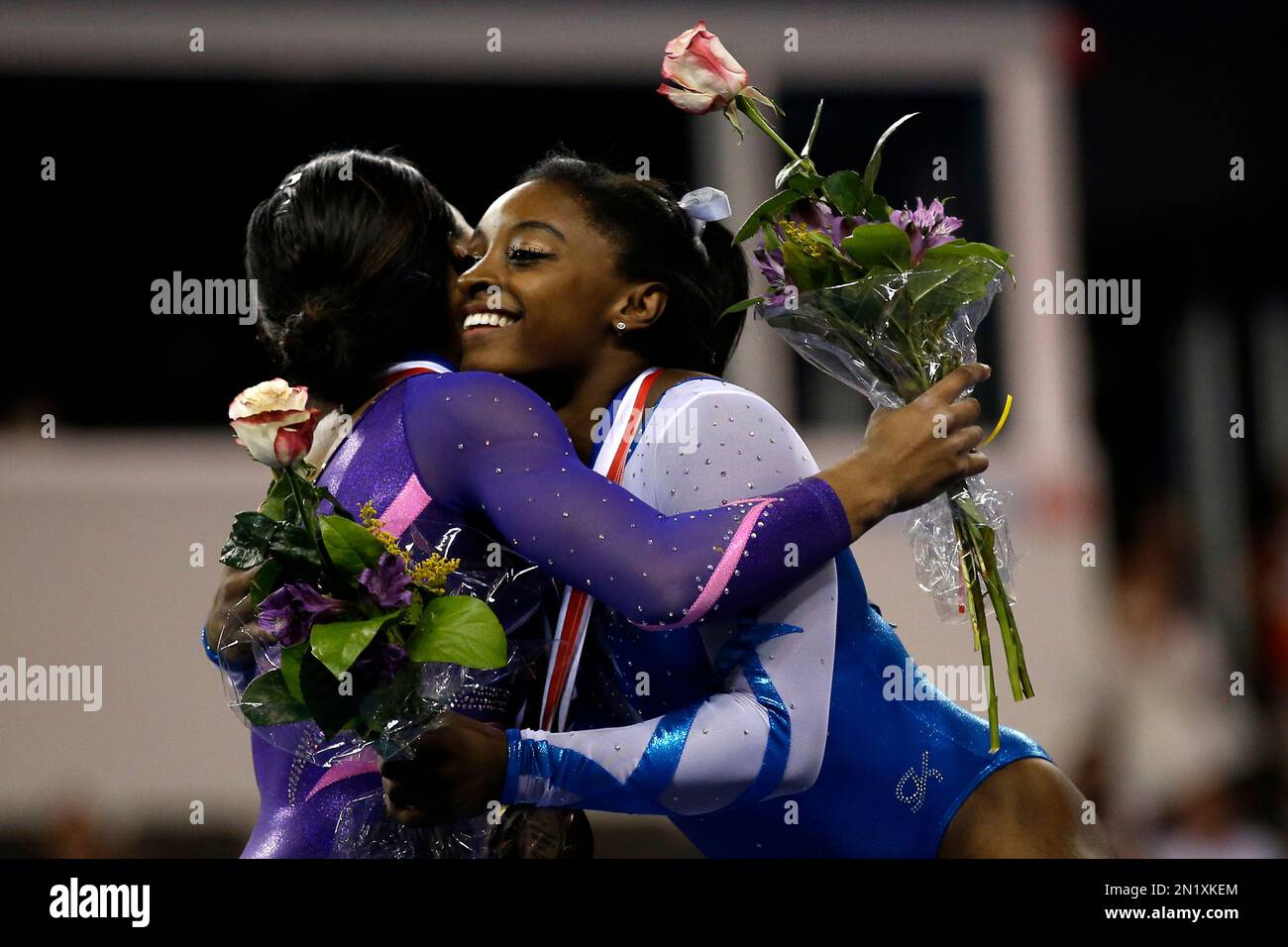 Simone Biles, right, hugs Gabby Douglas, left, after the Secret U.S ...