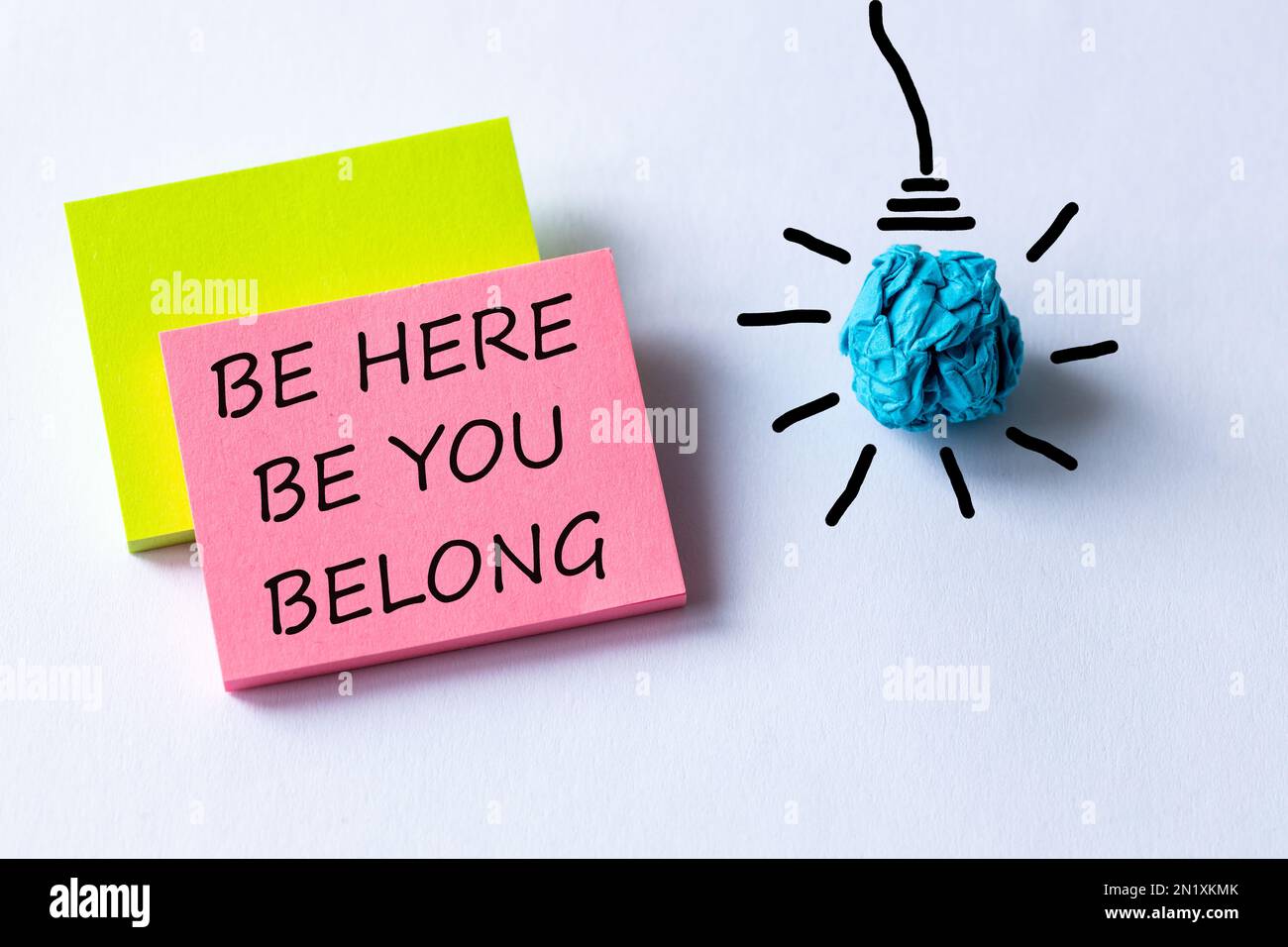 A symbol of belonging. words, be here, be you belong, written on ...