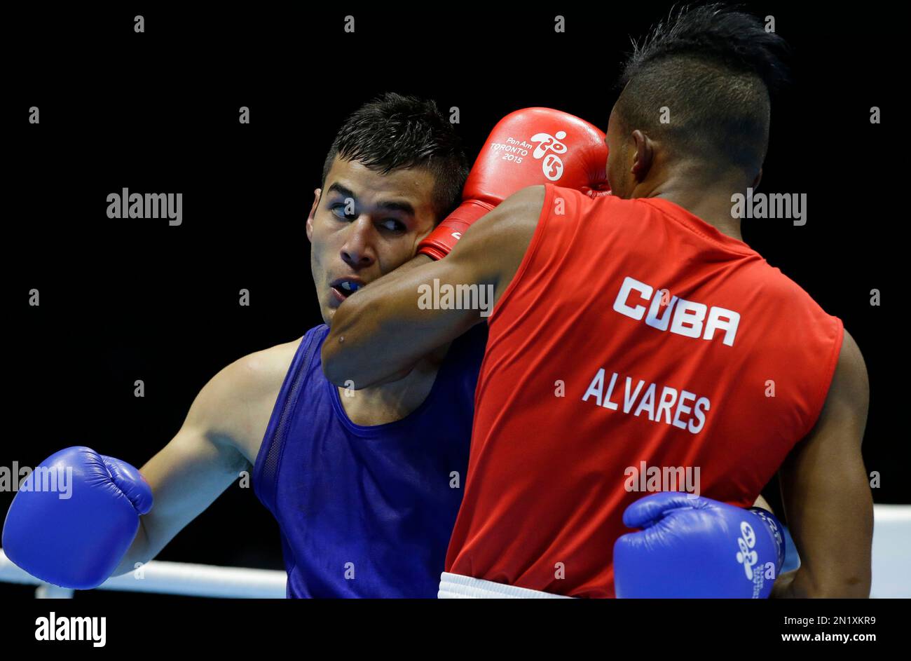 Mexico’s Lindolfo Delgado, left, battles with Cuba’s Lazaro Alvarez in ...