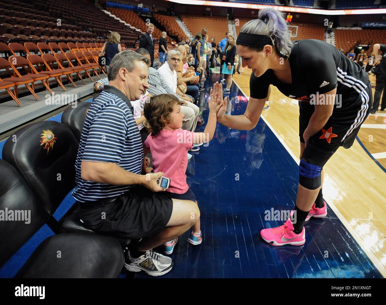 East’s Sefanie Dolson, of the Washington Mystics, high fives Emma ...