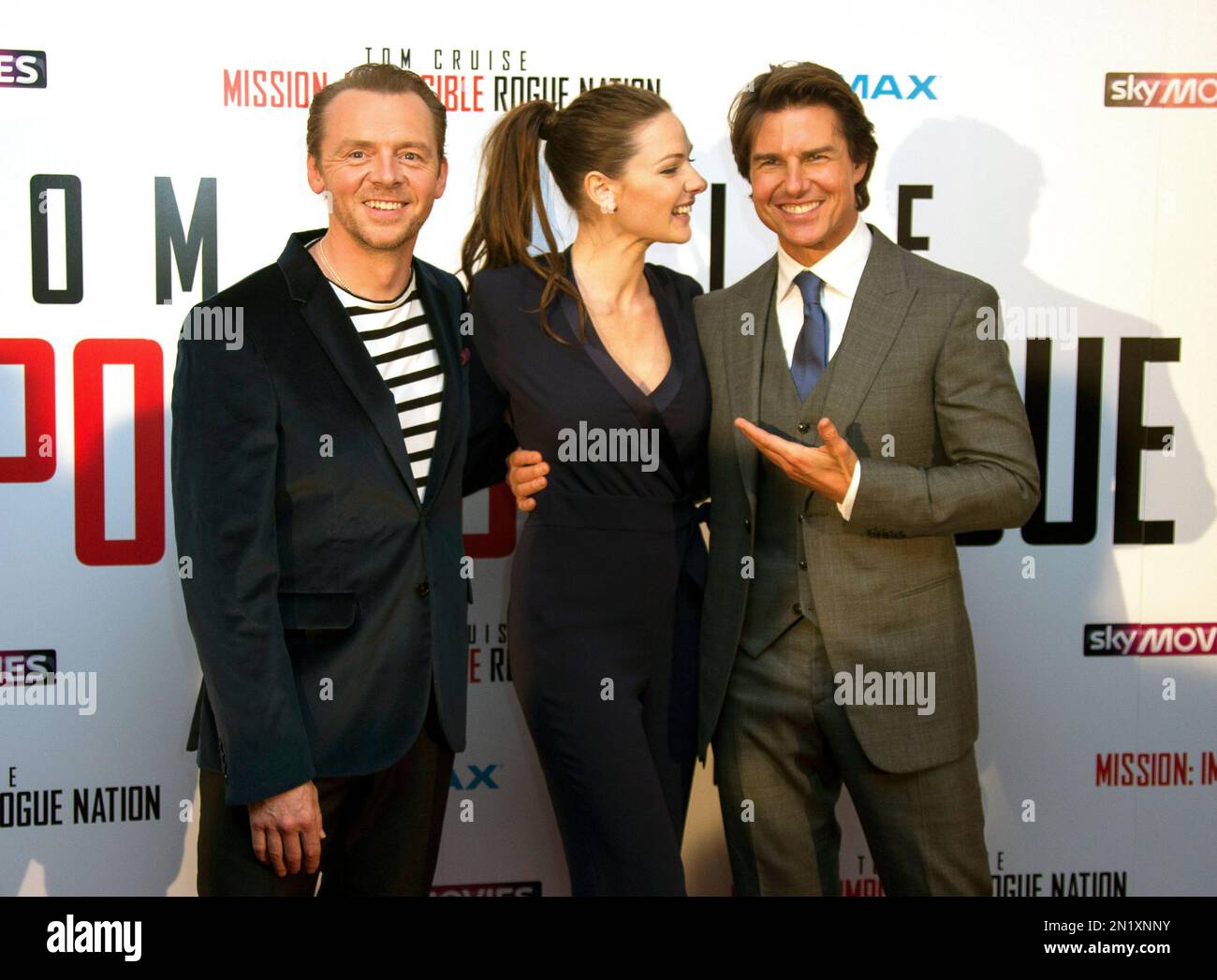 Actors Simon Pegg, left, Rebecca Ferguson, center, and Tom Cruise pose ...