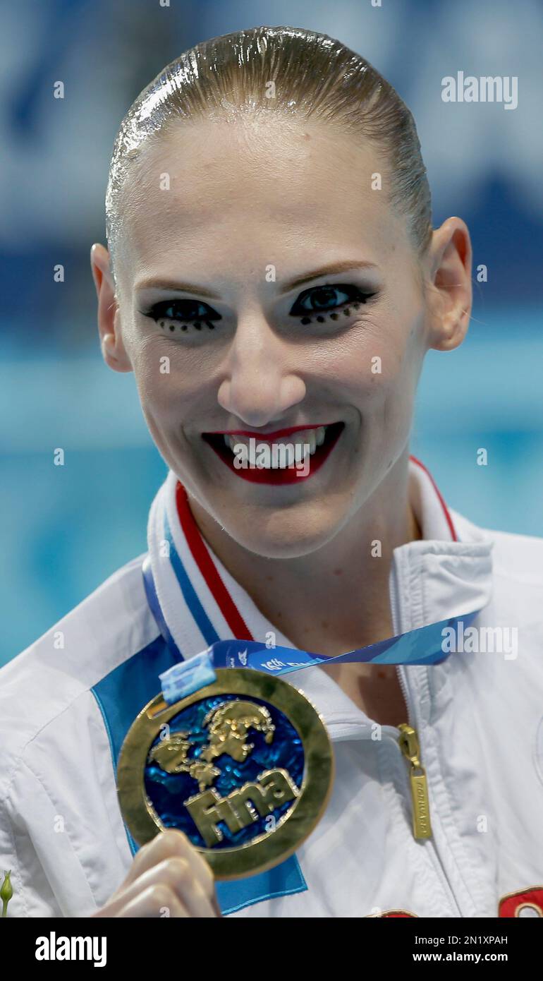 Russia's gold medalist Svetlana Romashina poses after the medal ...