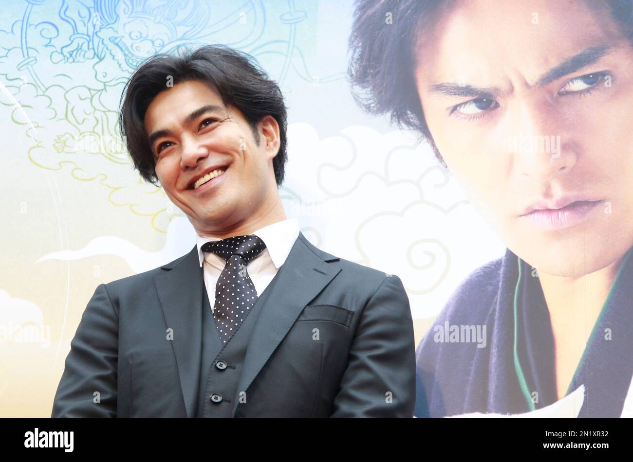 Japanese actor Kazuki Kitamura smiles during a media event to promote ...