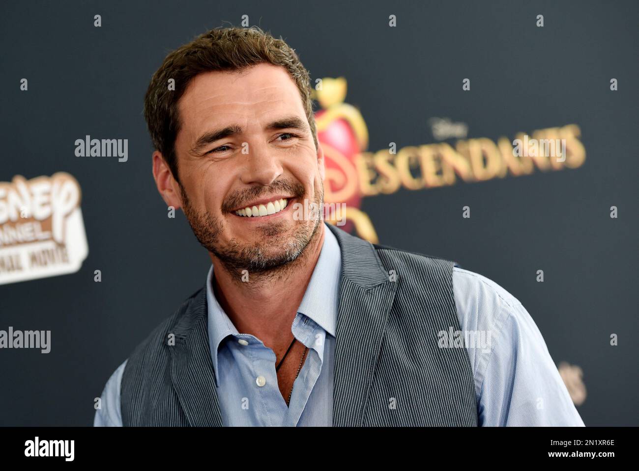 Dan Payne, a cast member in "Descendants," poses at the premiere of the ...