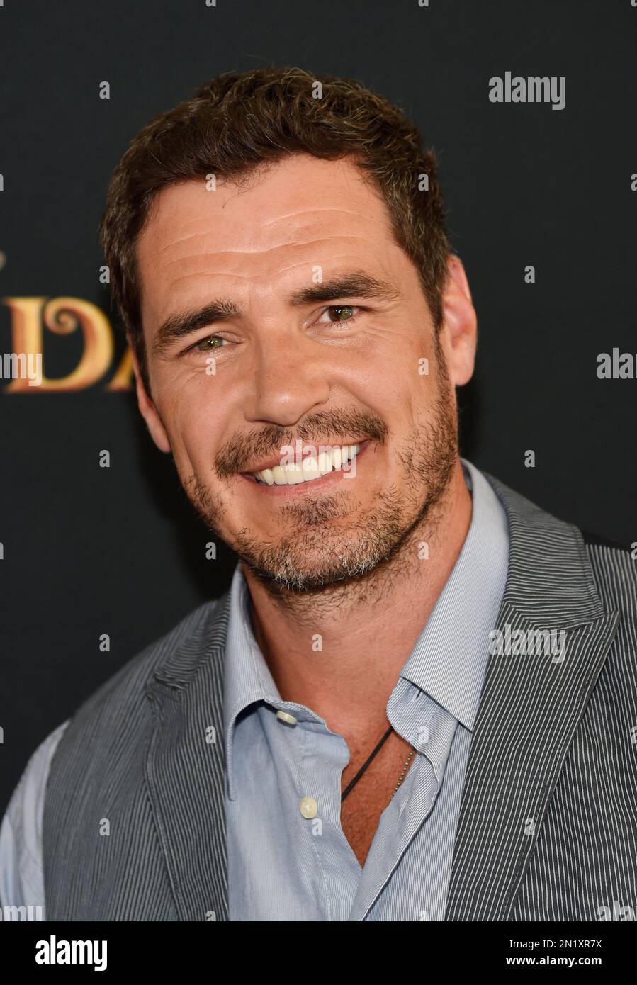 Dan Payne, a cast member in "Descendants," poses at the premiere of the ...