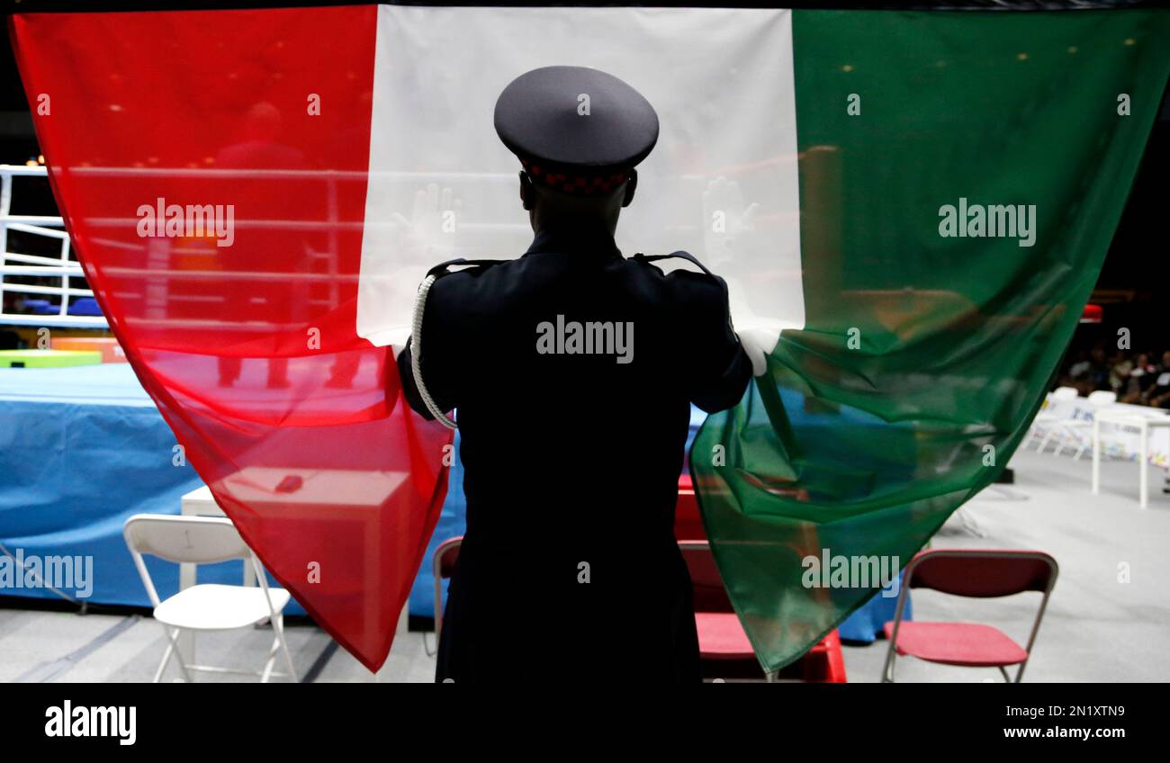An official holds the Mexico flag after Mexico's Joselito Velazquez was ...