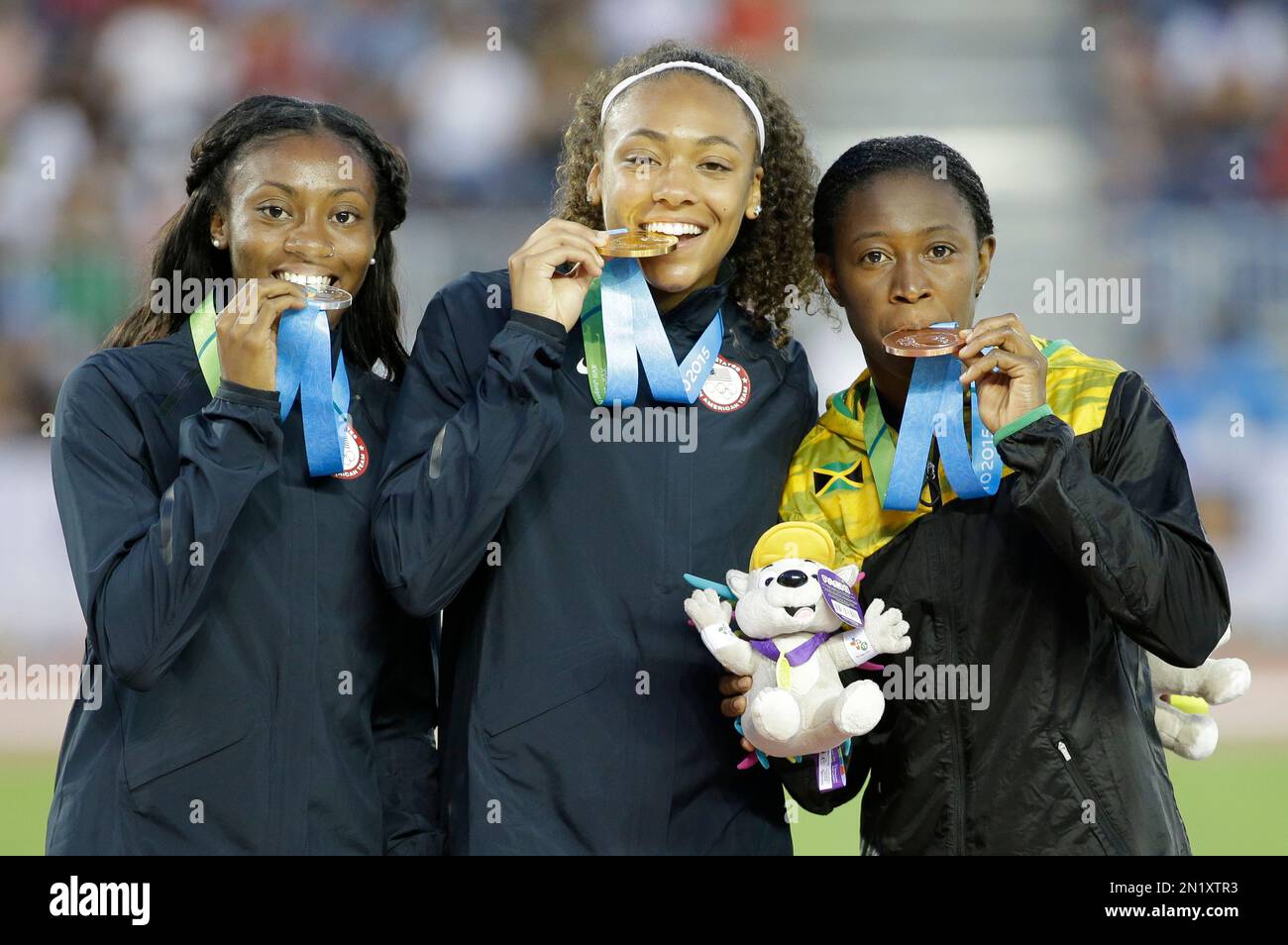 United States gold medal winner Kaylin Whitney, center, poses with ...