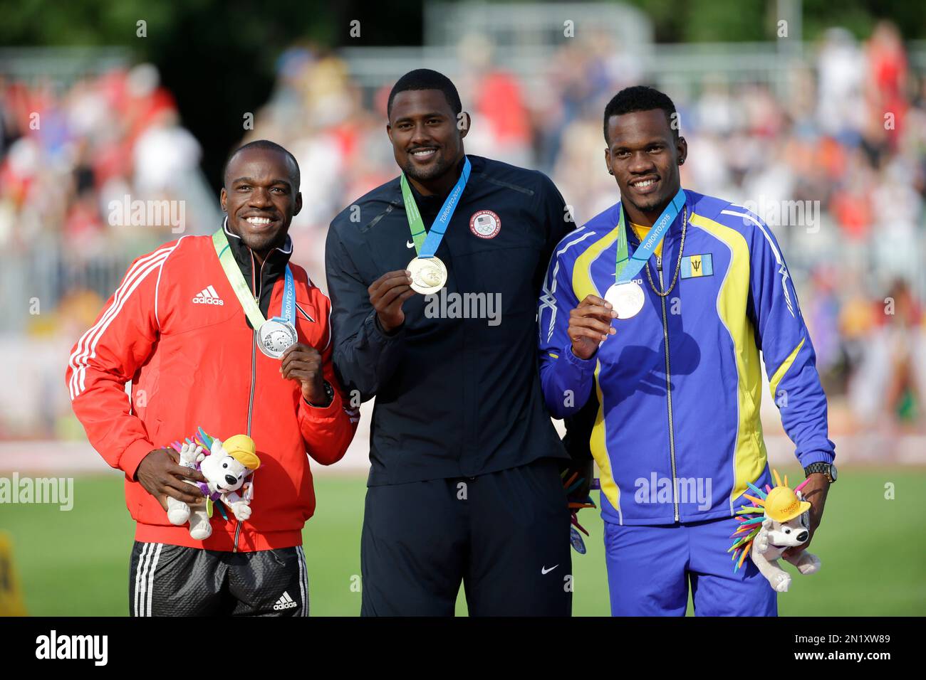 Gold medal winner David Oliver, center, of the United States, poses ...
