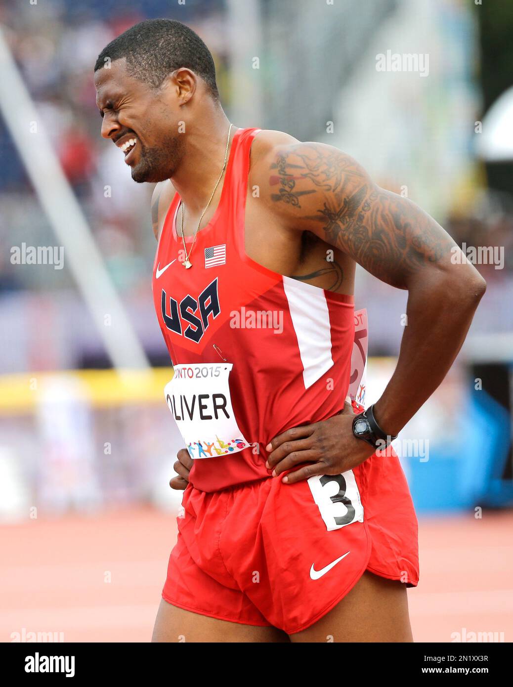 David Oliver, of the United States, catches his breath after winning ...